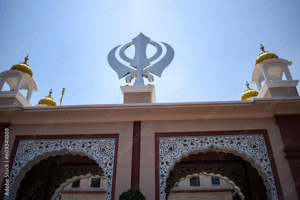 Khanda Sikh holy religious symbol at gurudwara entrance with bright ...