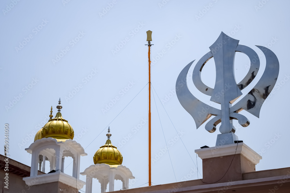 Khanda Sikh holy religious symbol at gurudwara entrance with bright ...