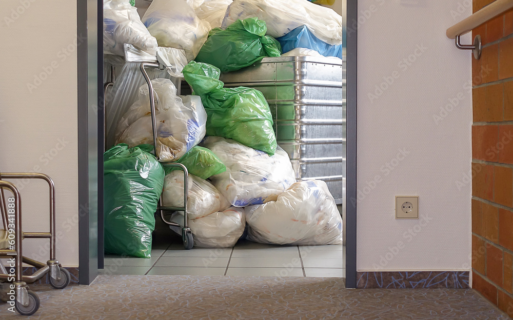 Medical waste in a nursing home. A large pile of plastic bags with ...