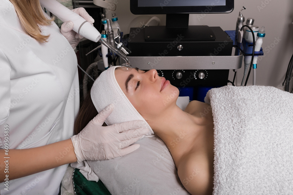 Violet ray treatment on face at the beautician. A violet ray is an ...