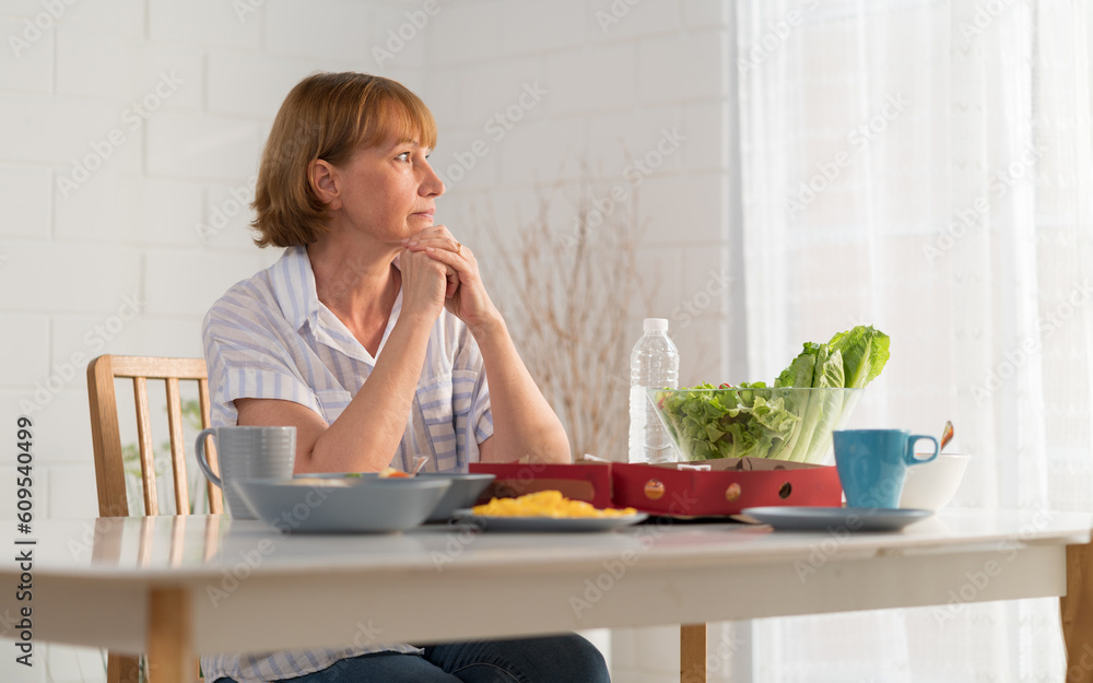 Elderly retired grandmother stay at home with painful face sitting ...