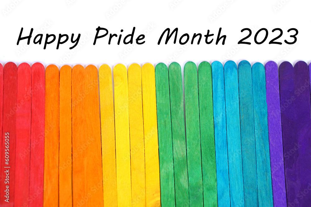 Colorful painted rainbow color on used ice cream sticks backgroud with ...