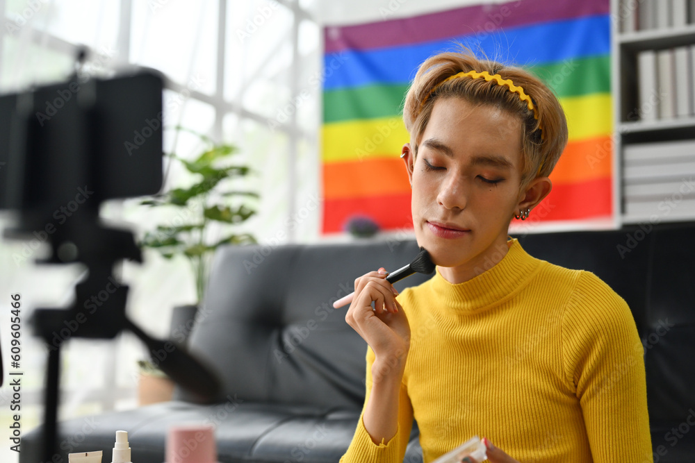 LGBT teenage boy influencer streaming online makeup video tutorial on ...