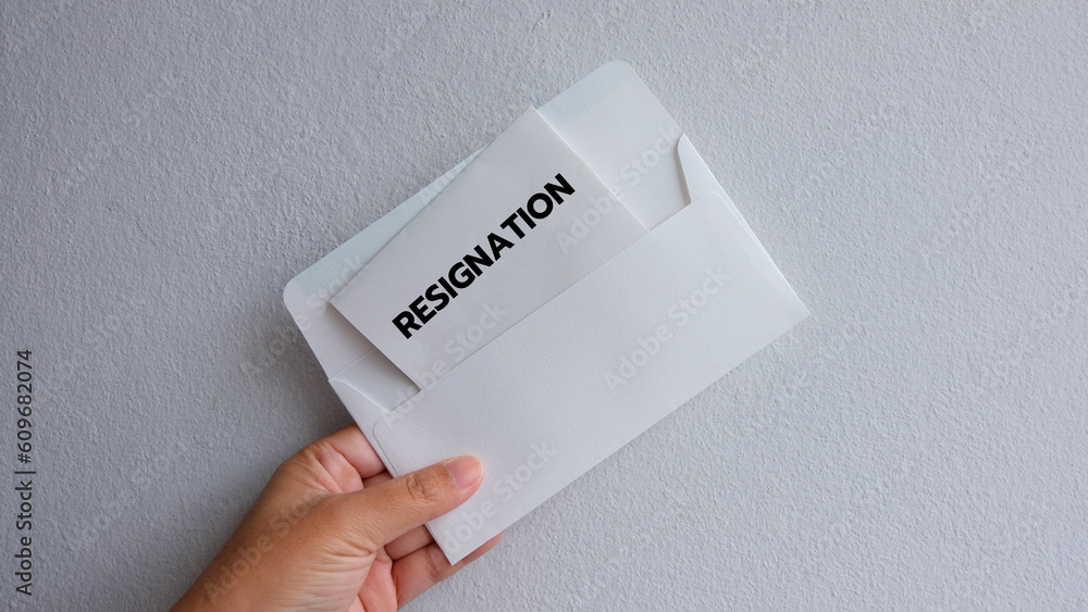 Hand handing resignation letter on white background. letter of ...