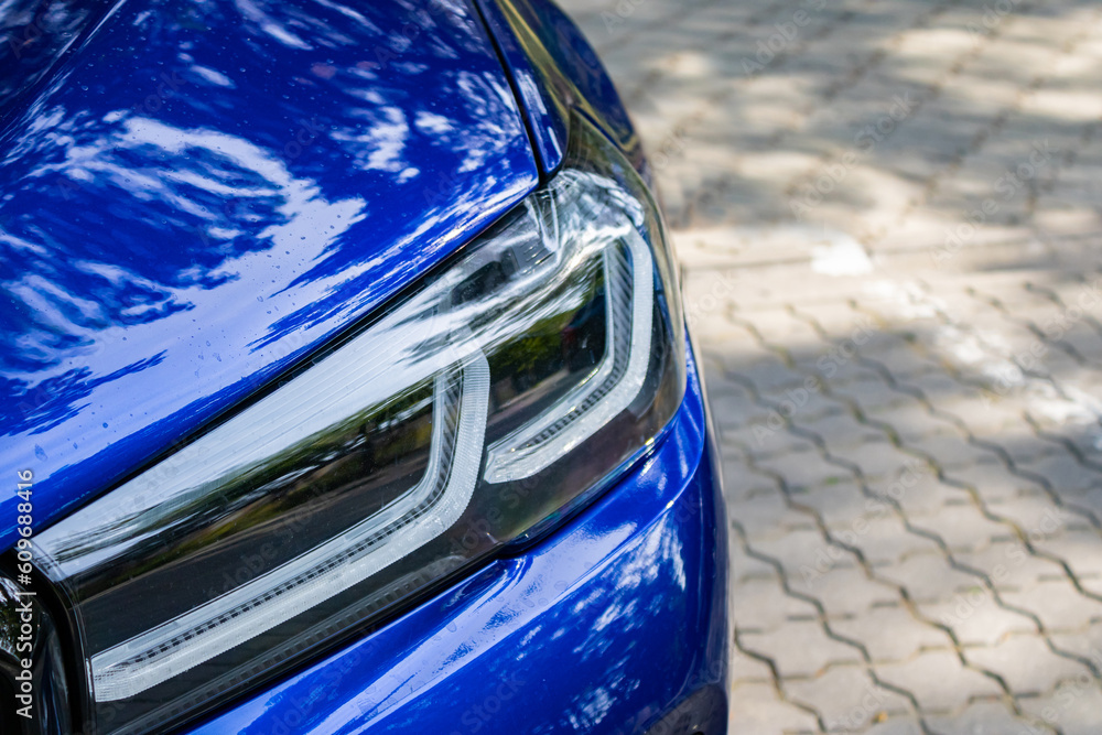 Car headlight. Lamp of modern car light. Close up view with copy space ...