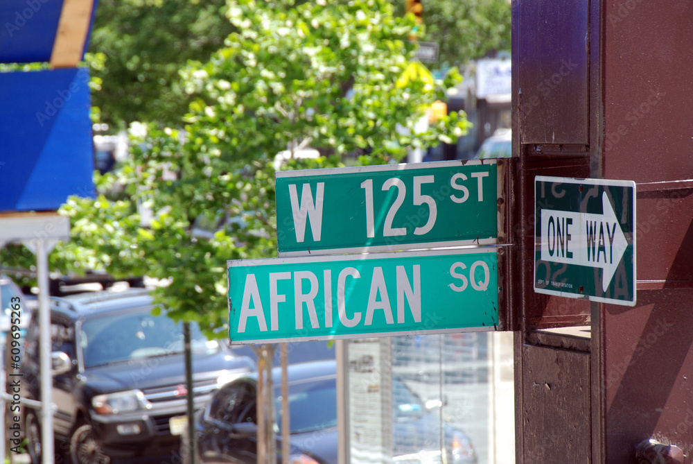 green road signs at the intersection of West 125th Street and African ...