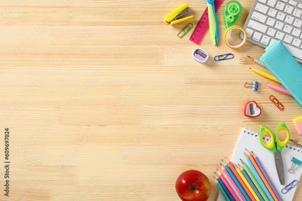 Back to school concept. Frame of colorful school supplies on wooden ...