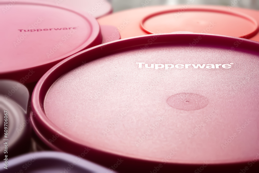 Tupperware lids. Tupperware brand lids with close-up logo. Textured ...