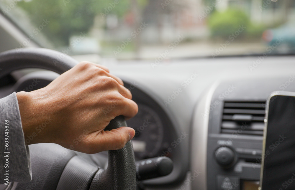 Car driving handle with hand: a symbol of control, independence ...