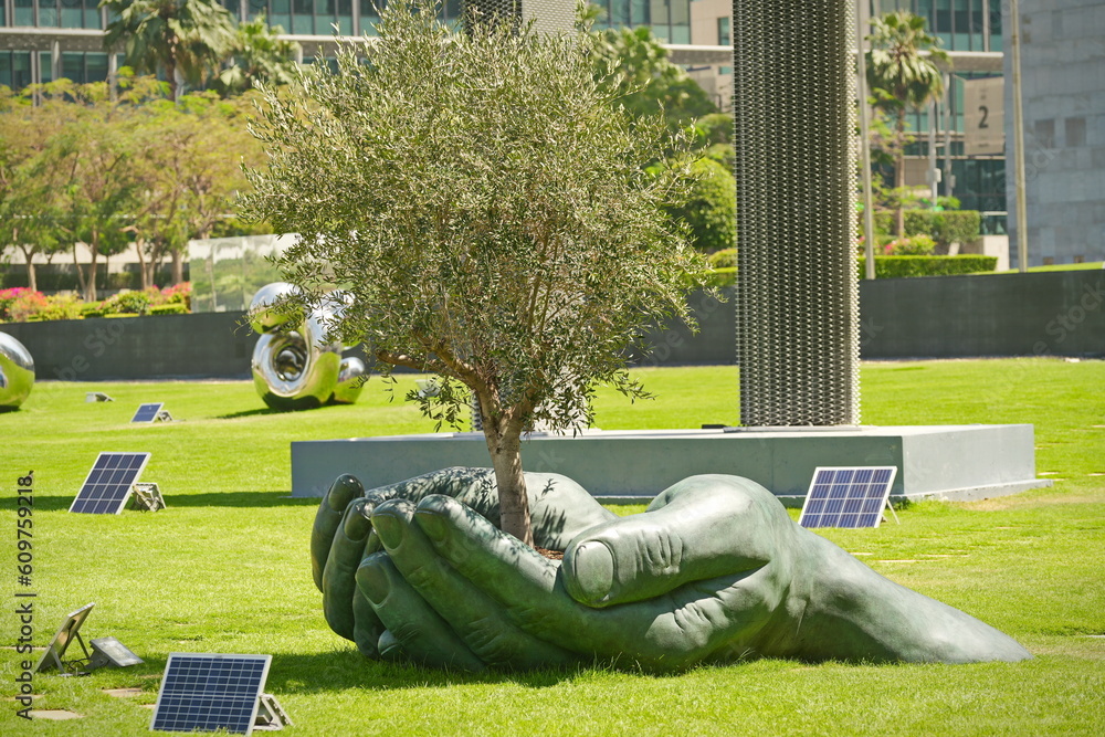 Hands holding tree sculpture. Symbol of conservation and protection of ...