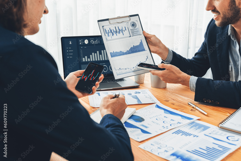 Busy analyst team in office analyzing financial data analysis for ...