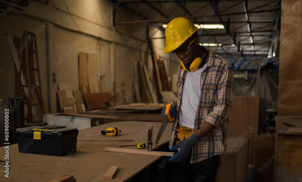 Black African Carpenter professional craftsmen wear safety gear. . He ...