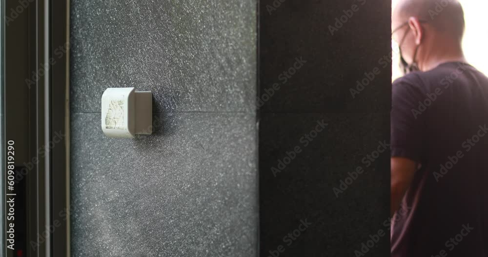 Use an electronic key card for access. Door access control. Man holding ...