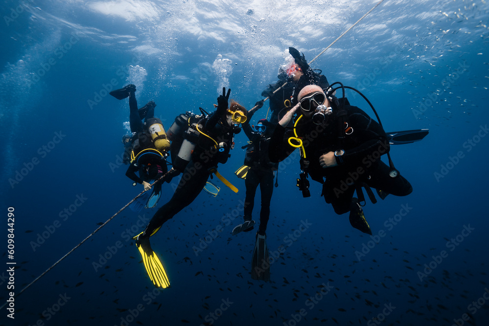 Friends together scuba diving in undersea Stock Photo | Adobe Stock