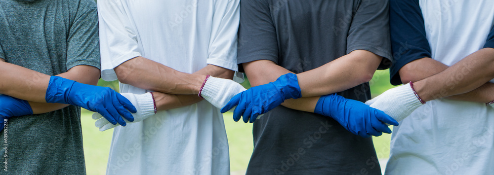 Volunteer holding hand together with green back ground.Teamwork,empathy ...