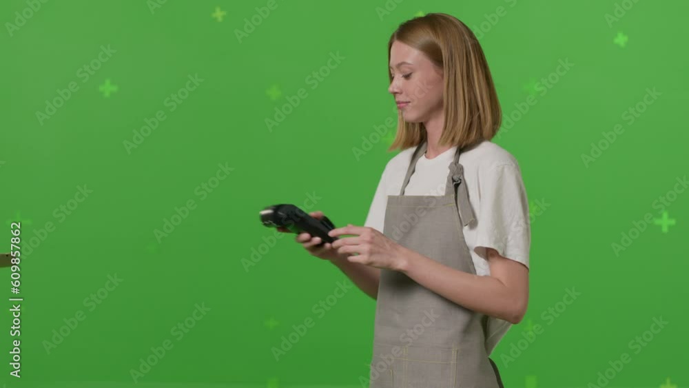 Girl waiter passing a box of pizza on green screen chroma key ...