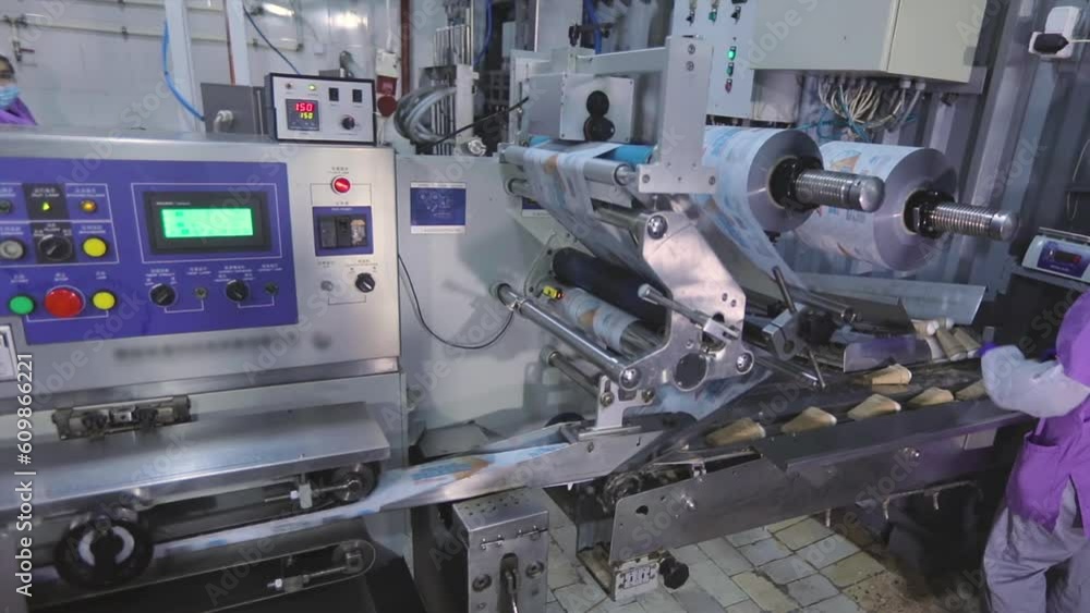 Modern ice cream factory. Automatic packaging line in an ice cream ...
