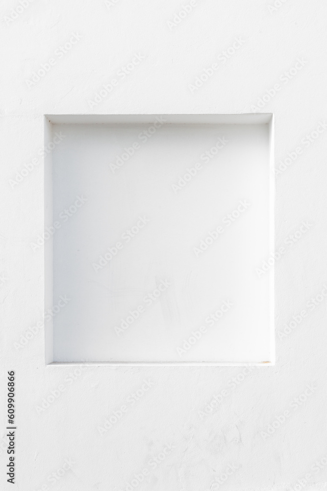 background of white wall with indentation in plastered wall forming a ...