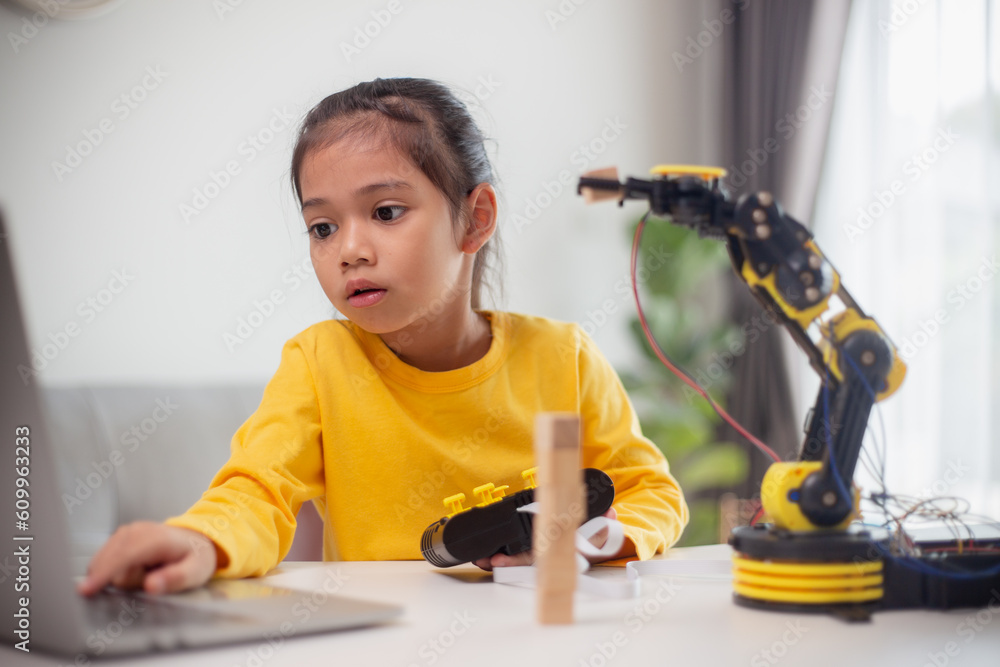 STEM education concept. Asian students learn at home by coding robot ...