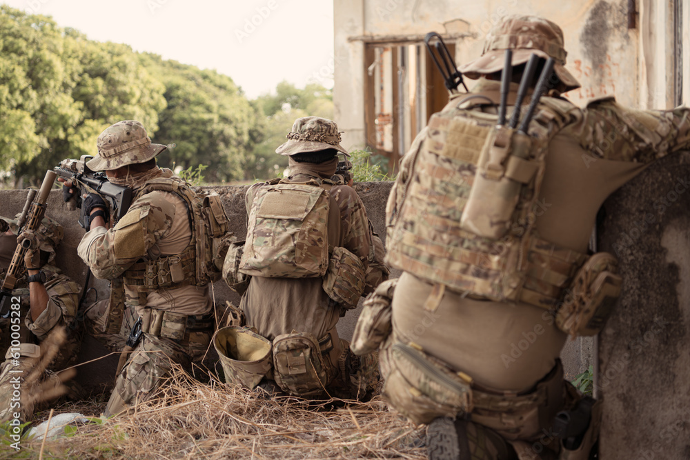Professional marine soldiers training with weapon on a military range ...