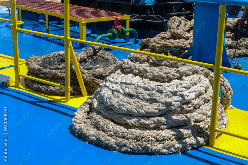 Mooring rope on the deck of commercial ship. Mechanical device ...