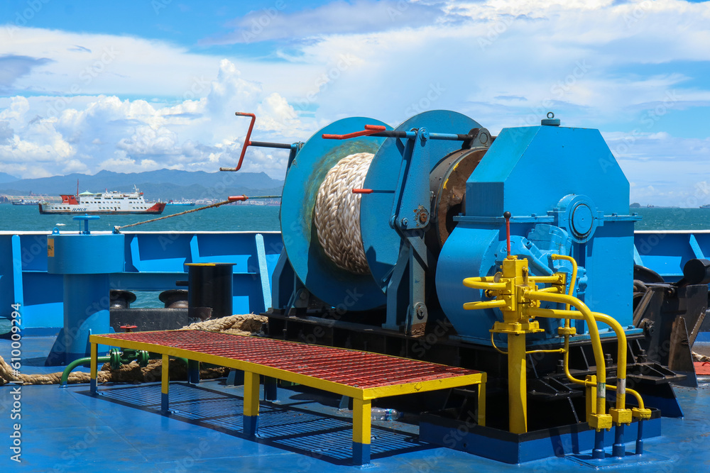 Mooring winch on a forward of a ferry with rope and chain in drum ...