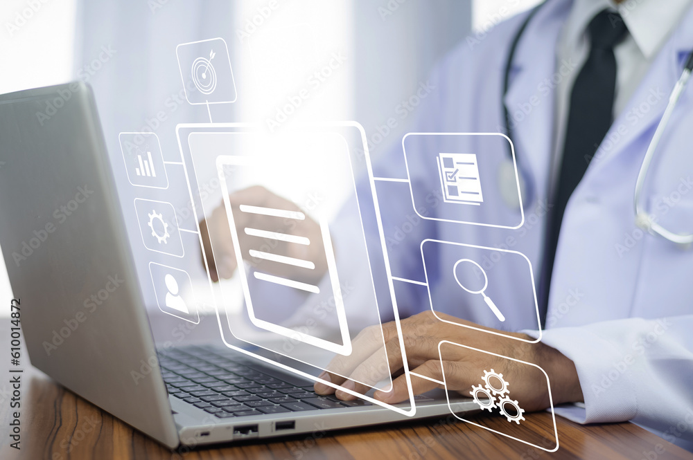 Doctor using computer Document Management System (DMS), online ...