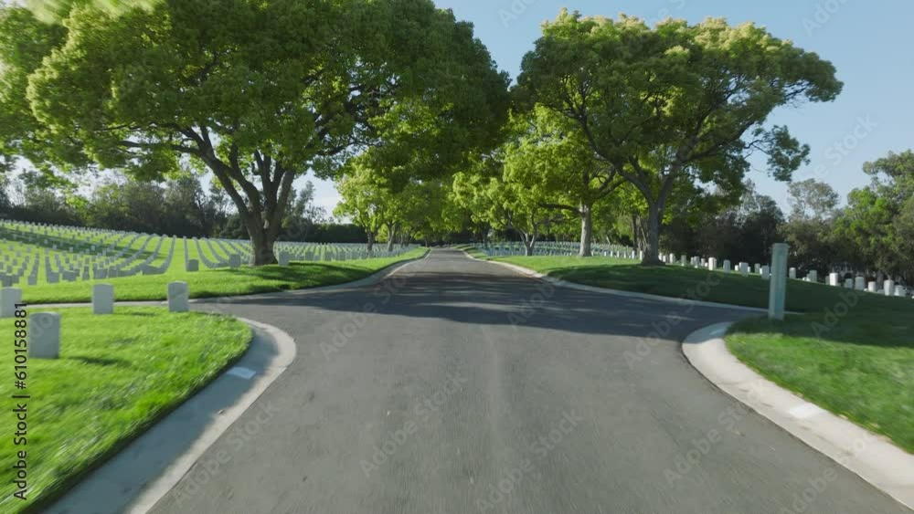 Drone flying fast along the road in cemetery park in California, United ...