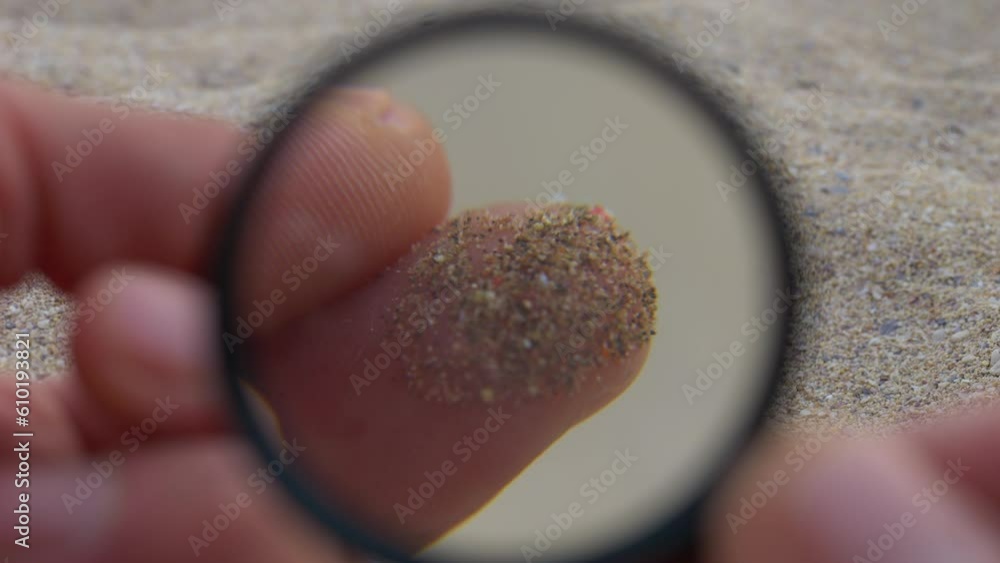 microplastic research, colorful plastic particles in sand close up view ...
