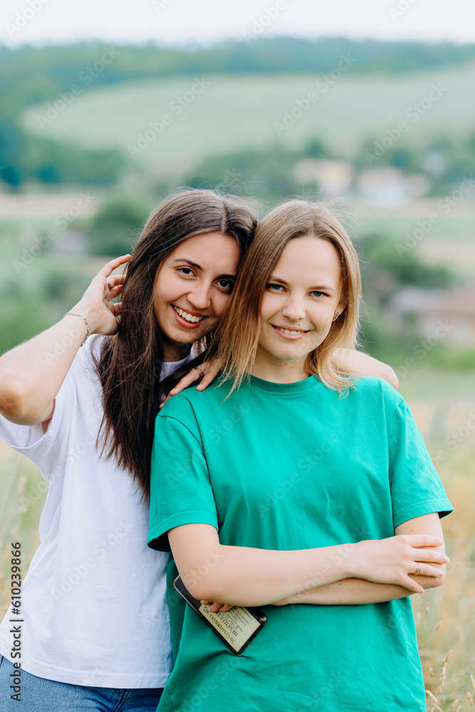 beautiful happy girlfriends.happy sisters.girls are resting in nature ...