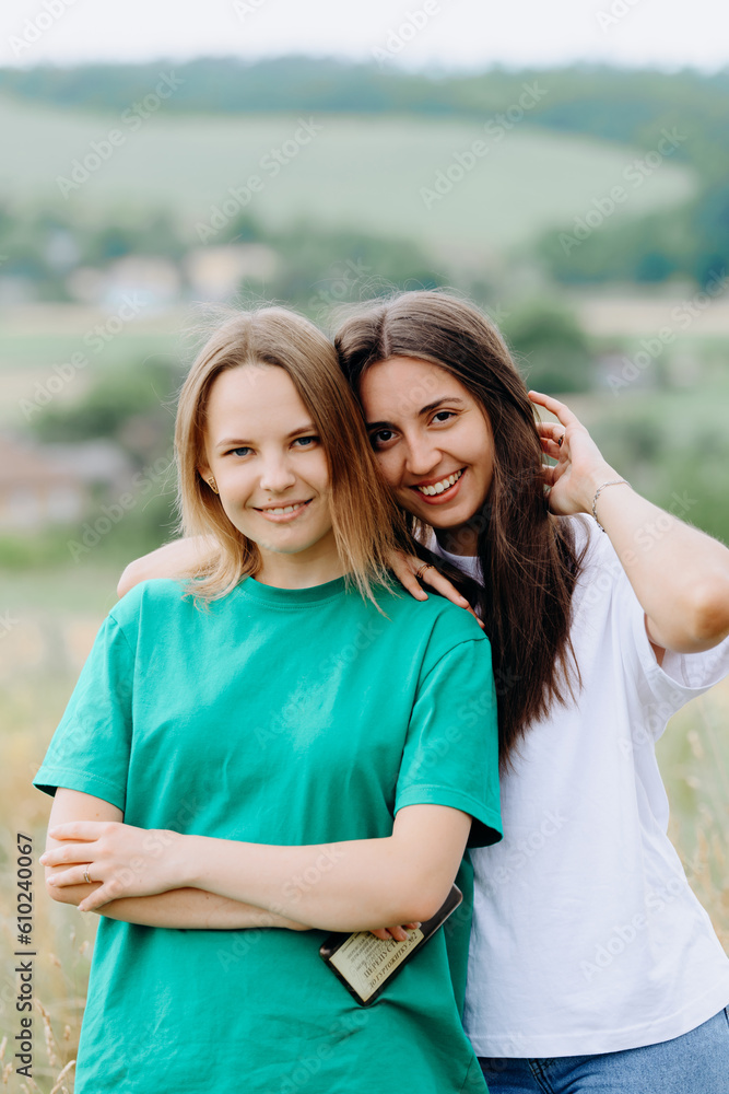 beautiful happy girlfriends.happy sisters.girls are resting in nature ...