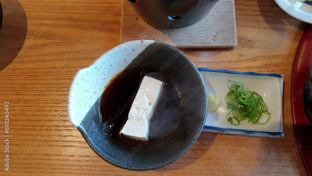 Fresh homemade white tofu boiling dip in yuzu soy sauce Kaizen ...