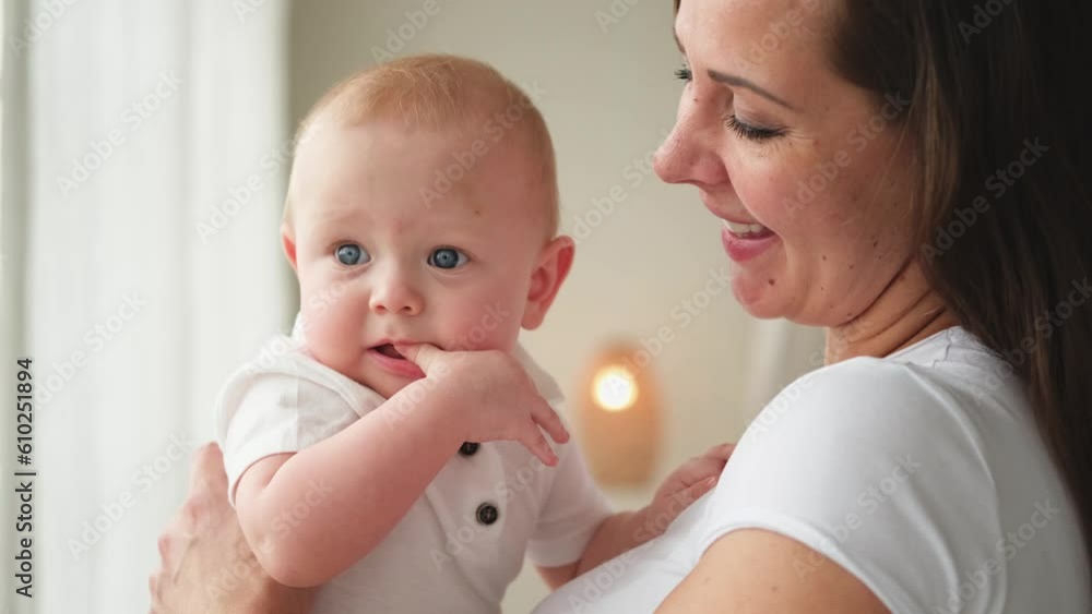 Happy family at home. Mother holding little toddler child daughter. Mom ...