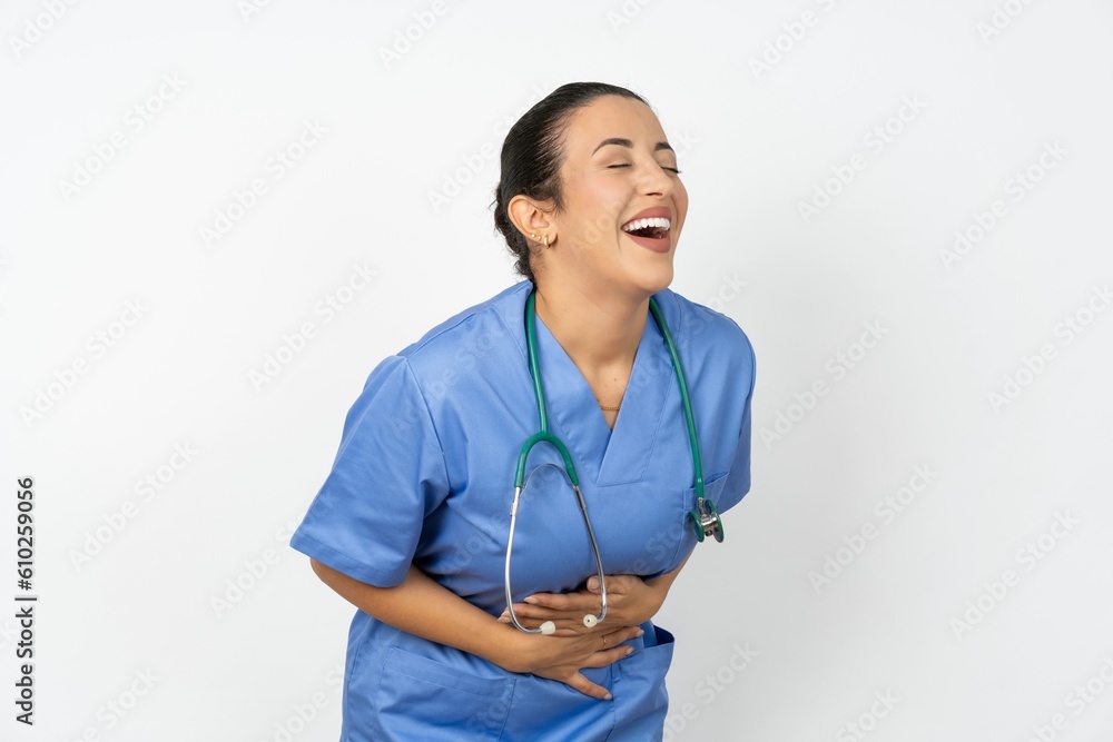 Beautiful doctor woman standing over white studio background smiling ...