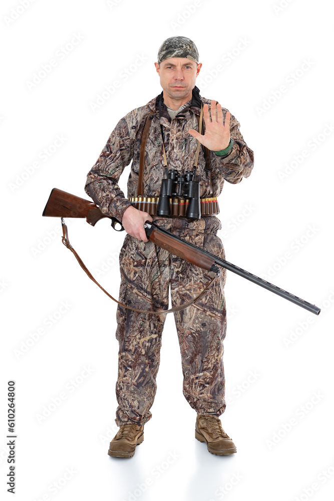 Duck hunter with a rifle and binoculars doing stop sing with palm of ...