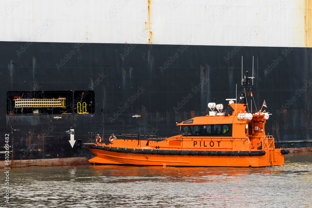 Pilot boat and cargo vessel at sea. Pilot embarkation. Pilotage. Stock Photo | Adobe Stock