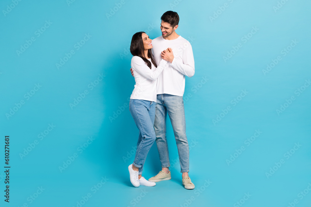 Full body photo of two idyllic positive people cuddle look each other ...