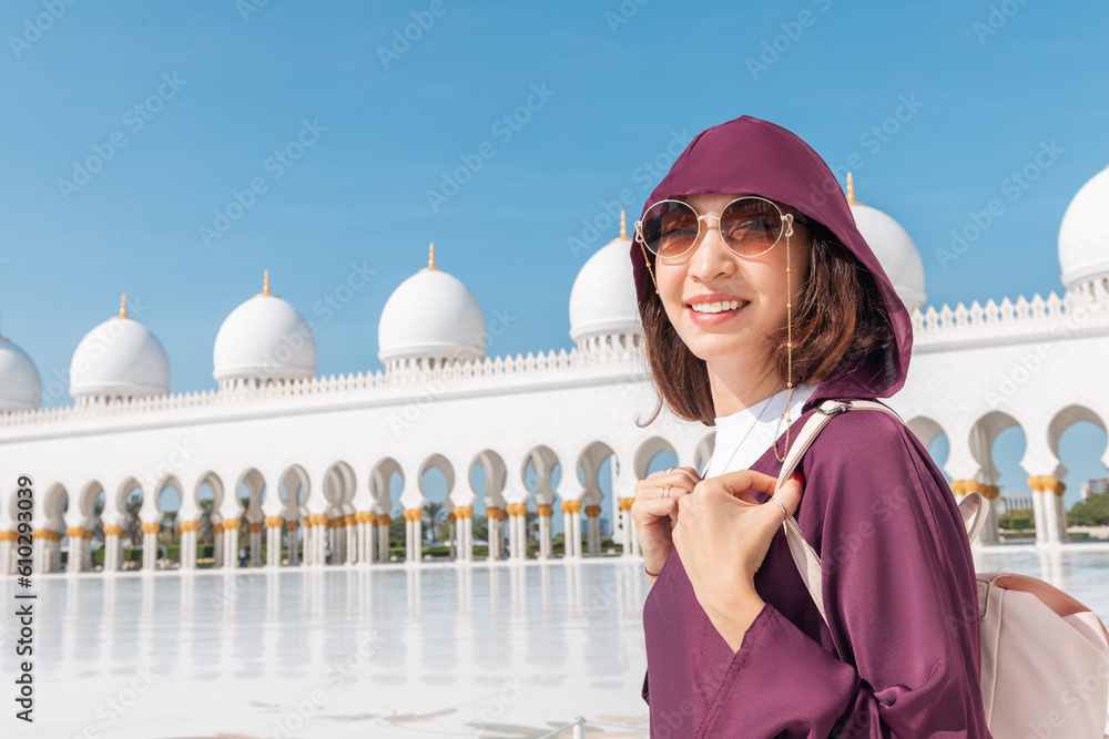 Against the backdrop of the awe-inspiring Sheikh Zayed Grand Mosque, a ...