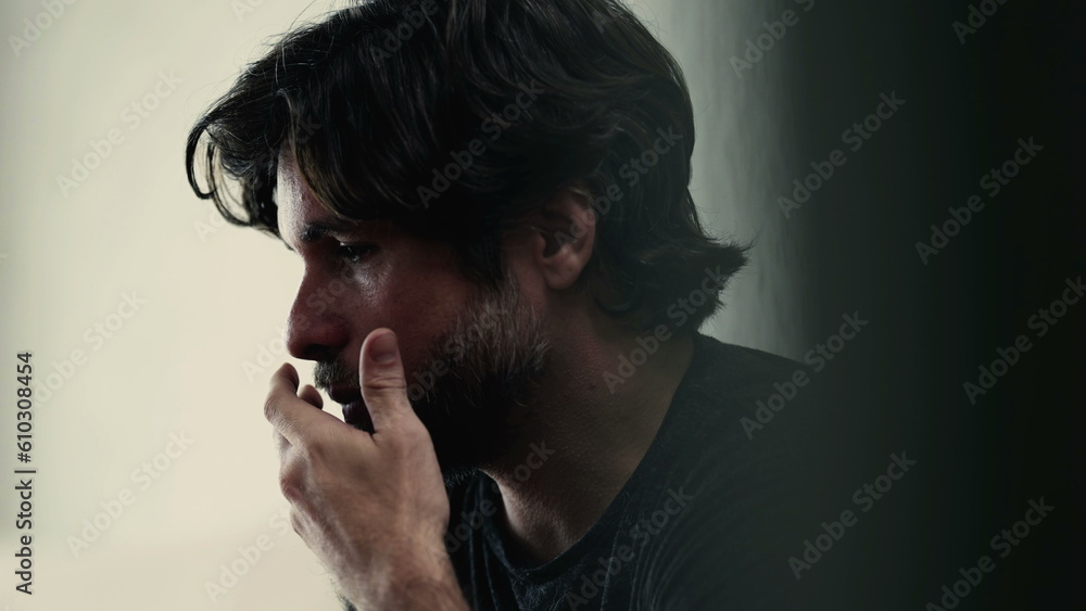 Worried young man mentally stuck in stress and anxiety. Preoccupied ...