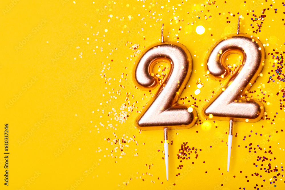 22 years celebration. Greeting banner. Gold candles in the form of ...