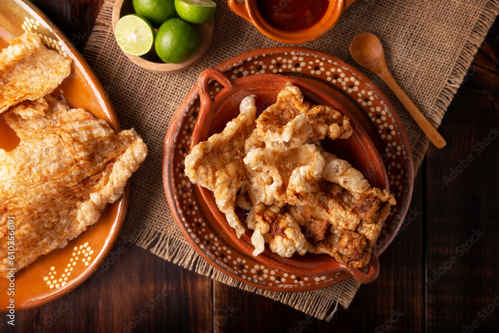Chicharron. Crispy Fried pork rind, are pieces of aired and fried pork ...