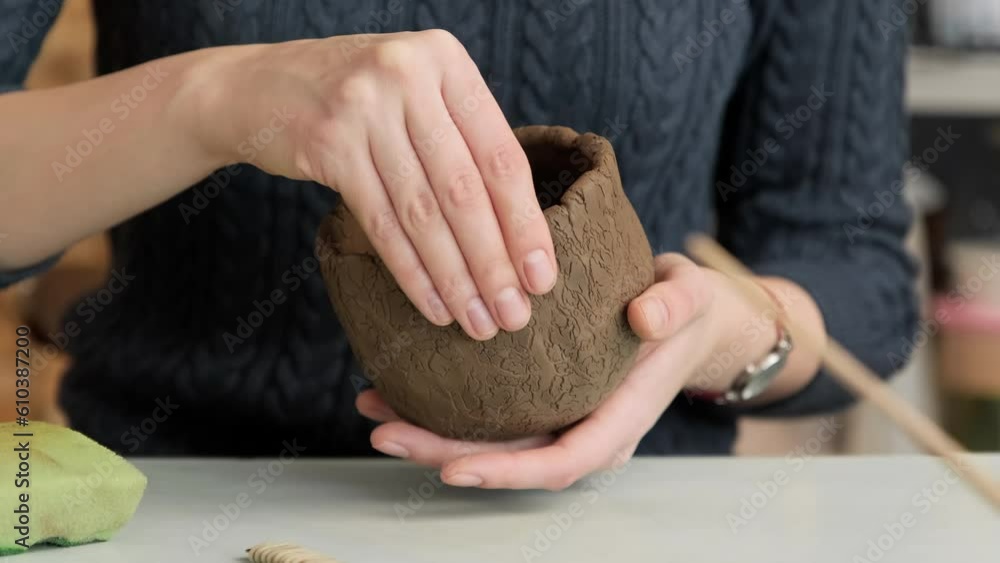 Woman forming vase from clay. Ceramist creating pottery. Young woman ...
