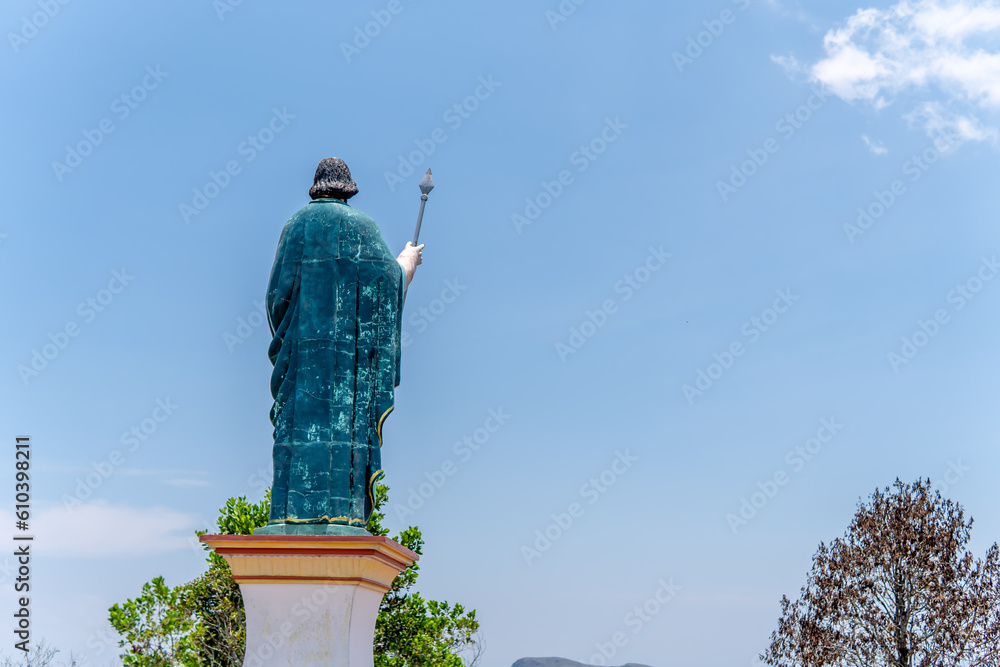 The back view of the majestic figure of Jesus Christ stands tall ...