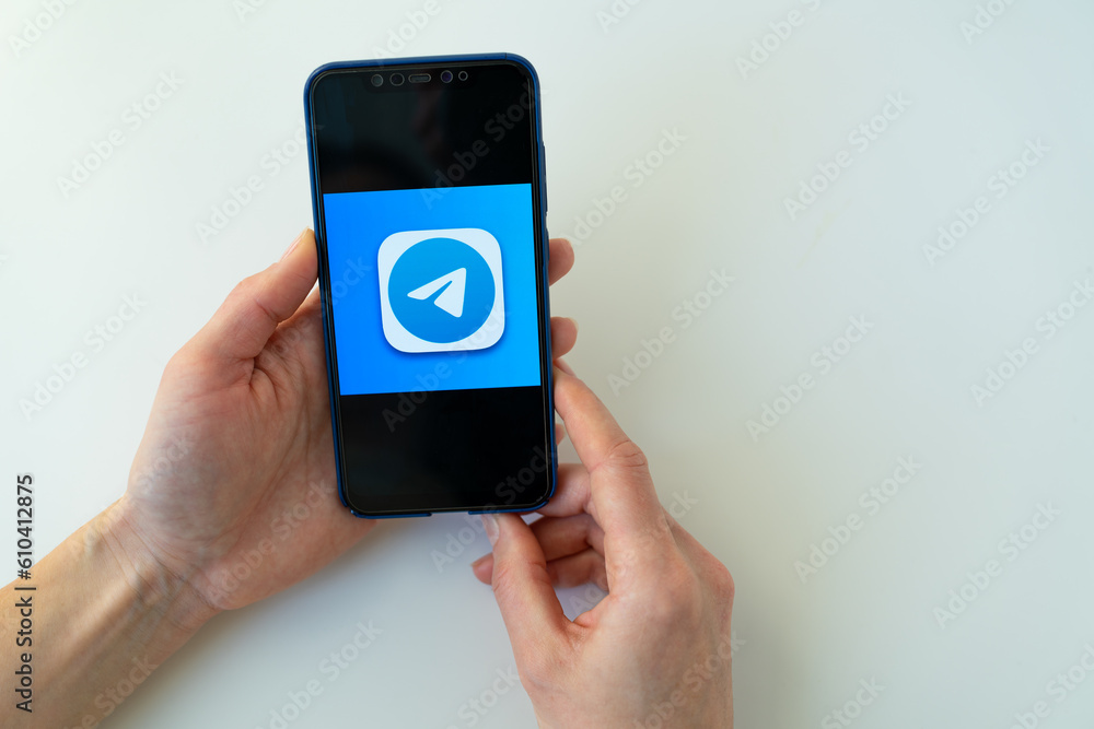 Kyiv, Ukraine - 13 December 2022: Girl over the table holding a ...