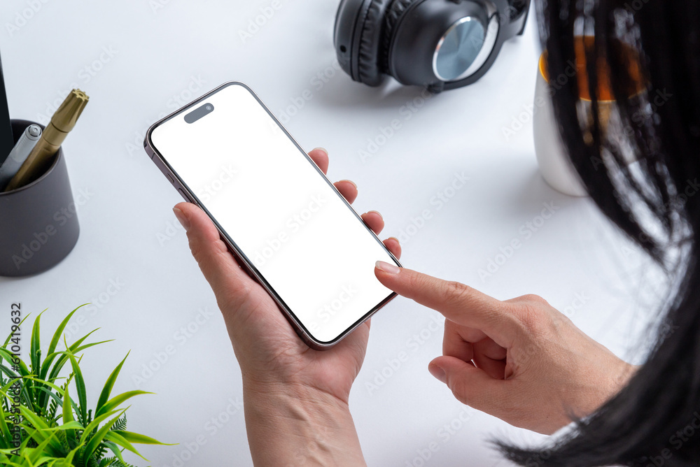 A woman holds a phone with an isolated screen for app presentation ...