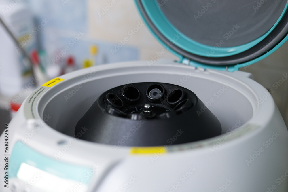 Laboratory centrifuge close-up stands on the table The centrifuge equipment helps in separating ...