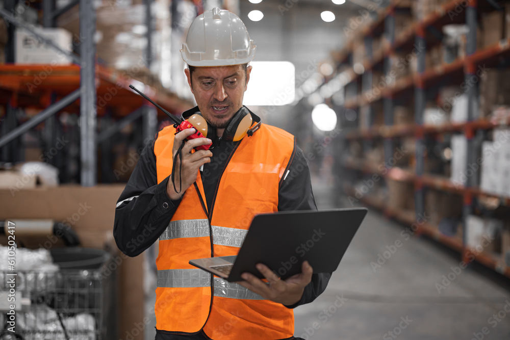 Warehouse supervisor uses two way radio for seamless communication and ...