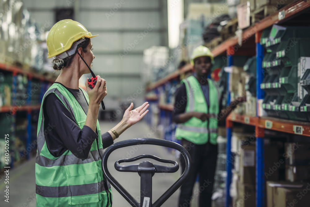 Warehouse supervisor uses two way radio for seamless communication and ...