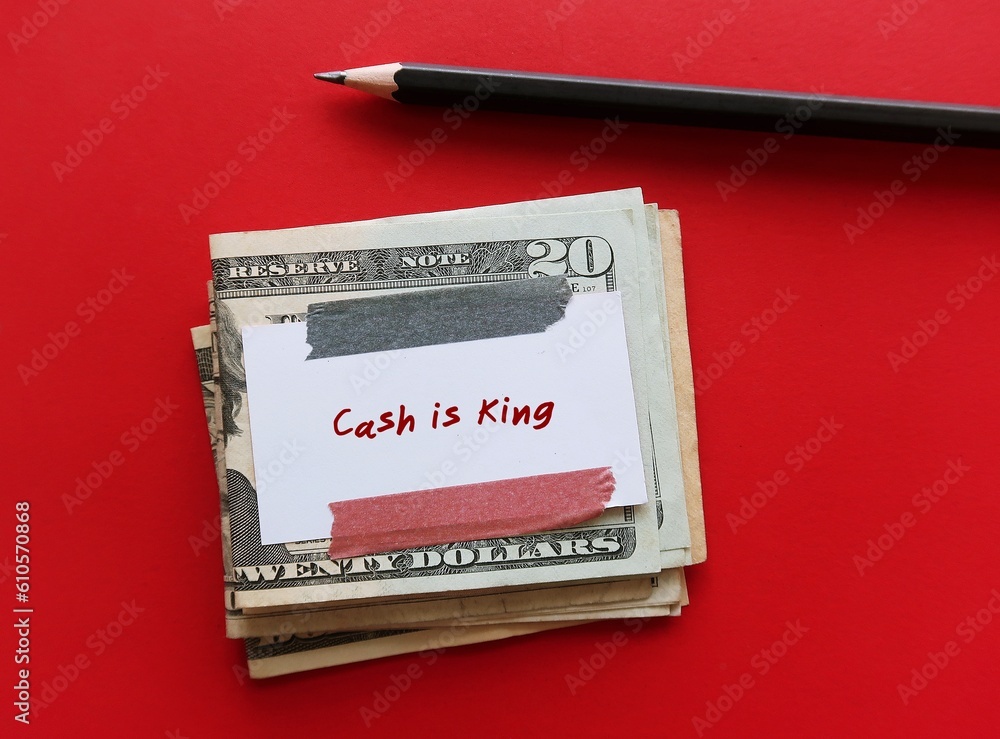 Note stick on cash dollars money on red background with handwritten ...