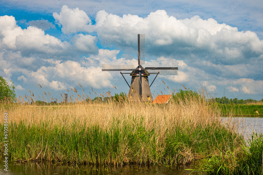 View of traditional windmills and canals in Kinderdijk Village in the ...